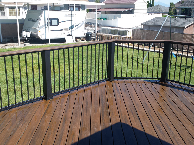 Iron w/composite post & 1x6 cap rail - CFC Fences & Decks